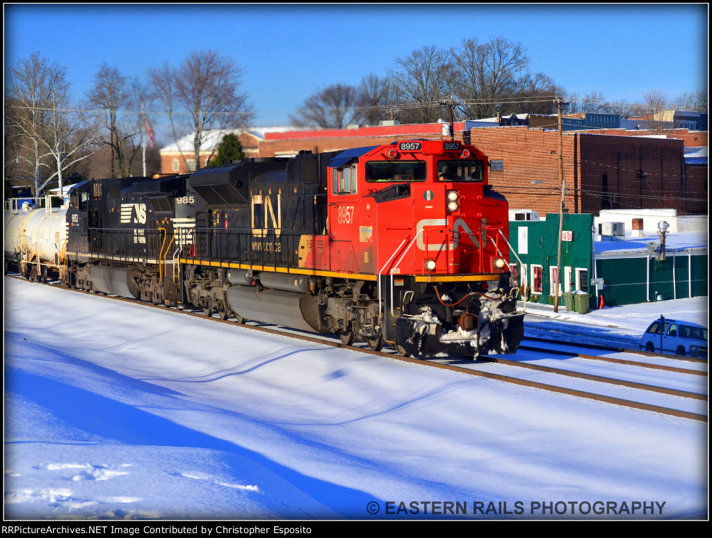 CN SD70M-2 8957 leads 337 down the snow covered R Line